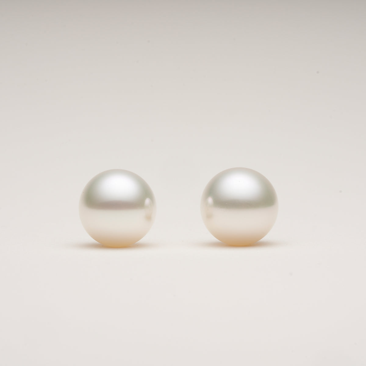 Pair of Round 12 mm pearls, Flawless Complexion, AA Lustre, Silver wit ...